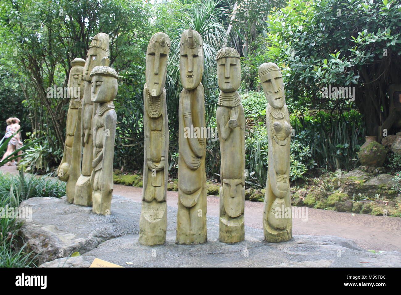 wooden idol isolated on nature Stock Photo - Alamy