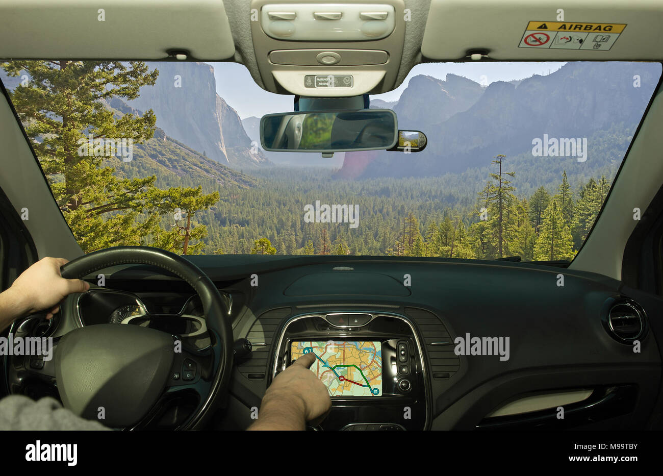 Driving a car while using the touch screen of a GPS navigation system ...