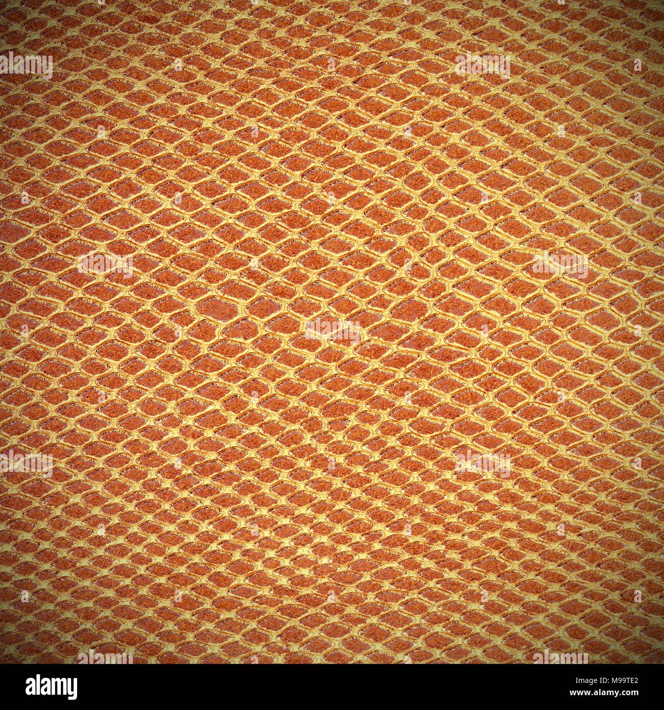 large golden background of scales similar to snakeskin with rhomboid ...