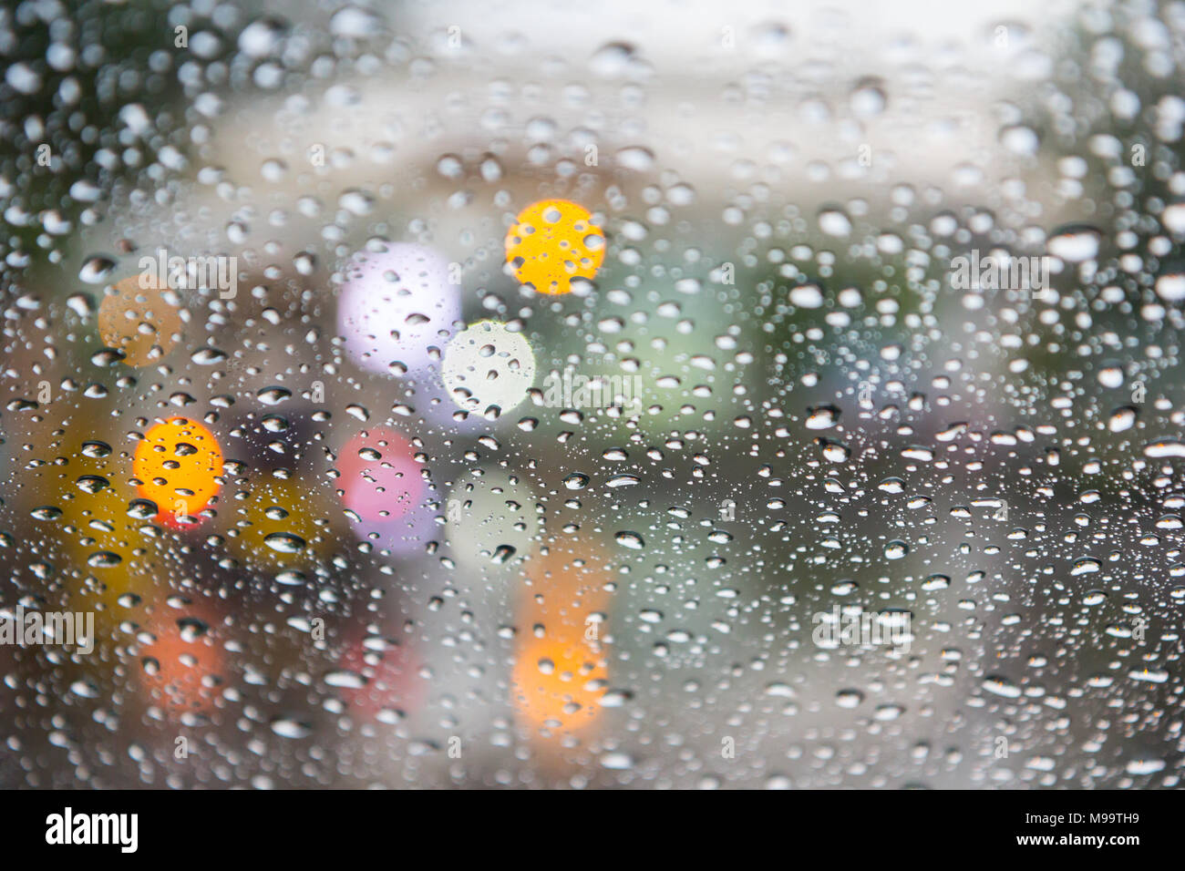 Water drops on glass raining day Stock Photo - Alamy