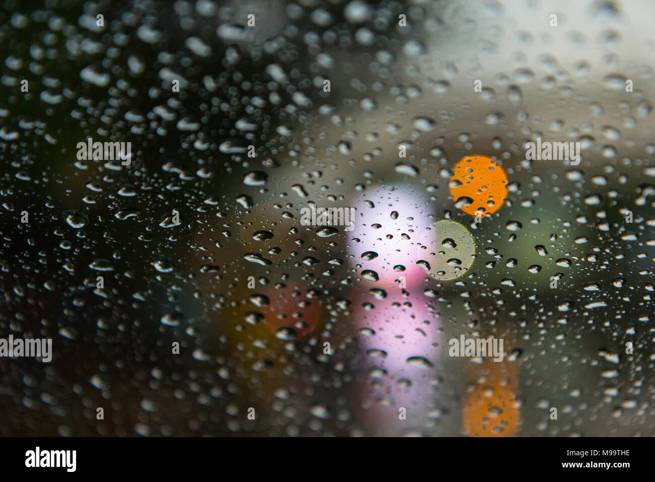 Water drops on glass raining day Stock Photo - Alamy