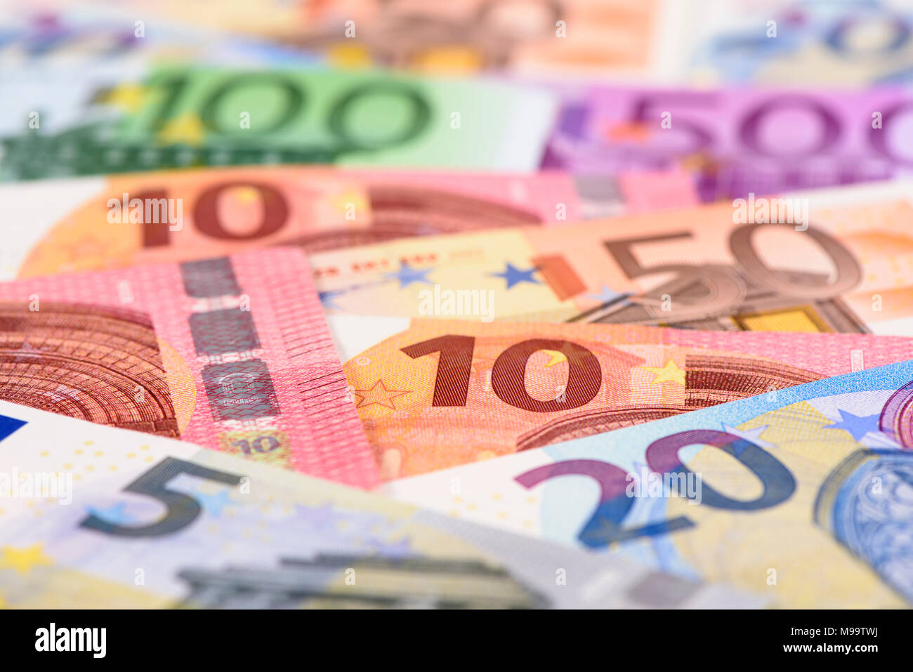 group of many Euro banknotes laying on table Stock Photo - Alamy