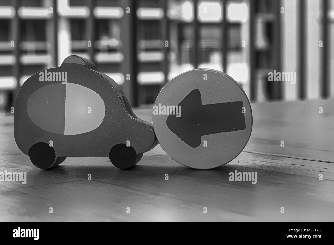 Wooden toy cars with arrow on the circle on the table Stock Photo - Alamy