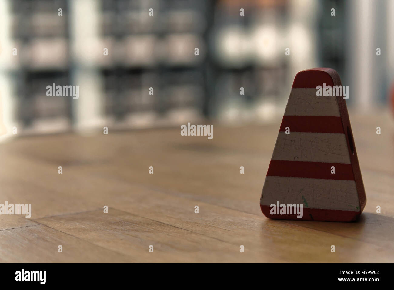 Toy caution wooden traffic pylon, warning conus Stock Photo - Alamy