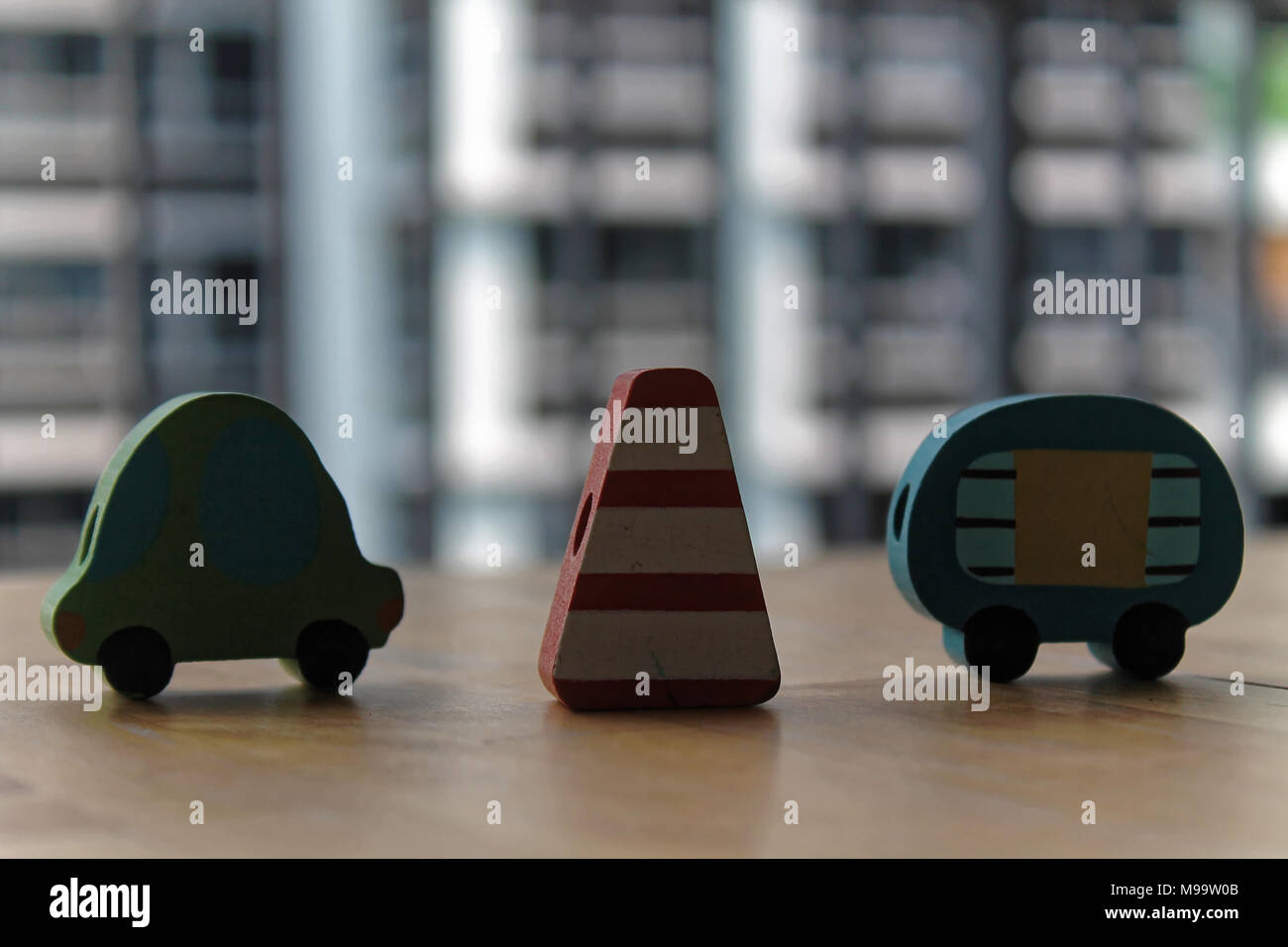 Wooden toy cars with traffic pylon on the table Stock Photo - Alamy