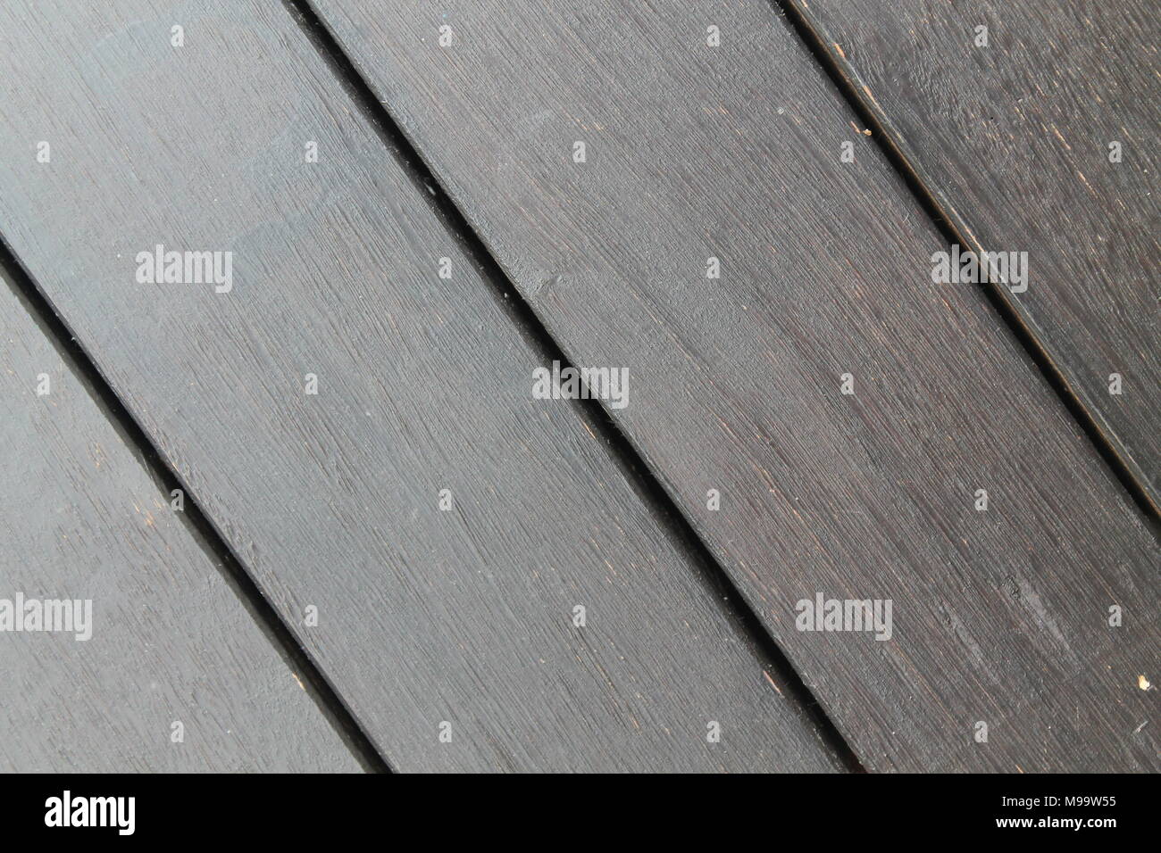 Background texture of wooden decking with parallel planks with gaps ...