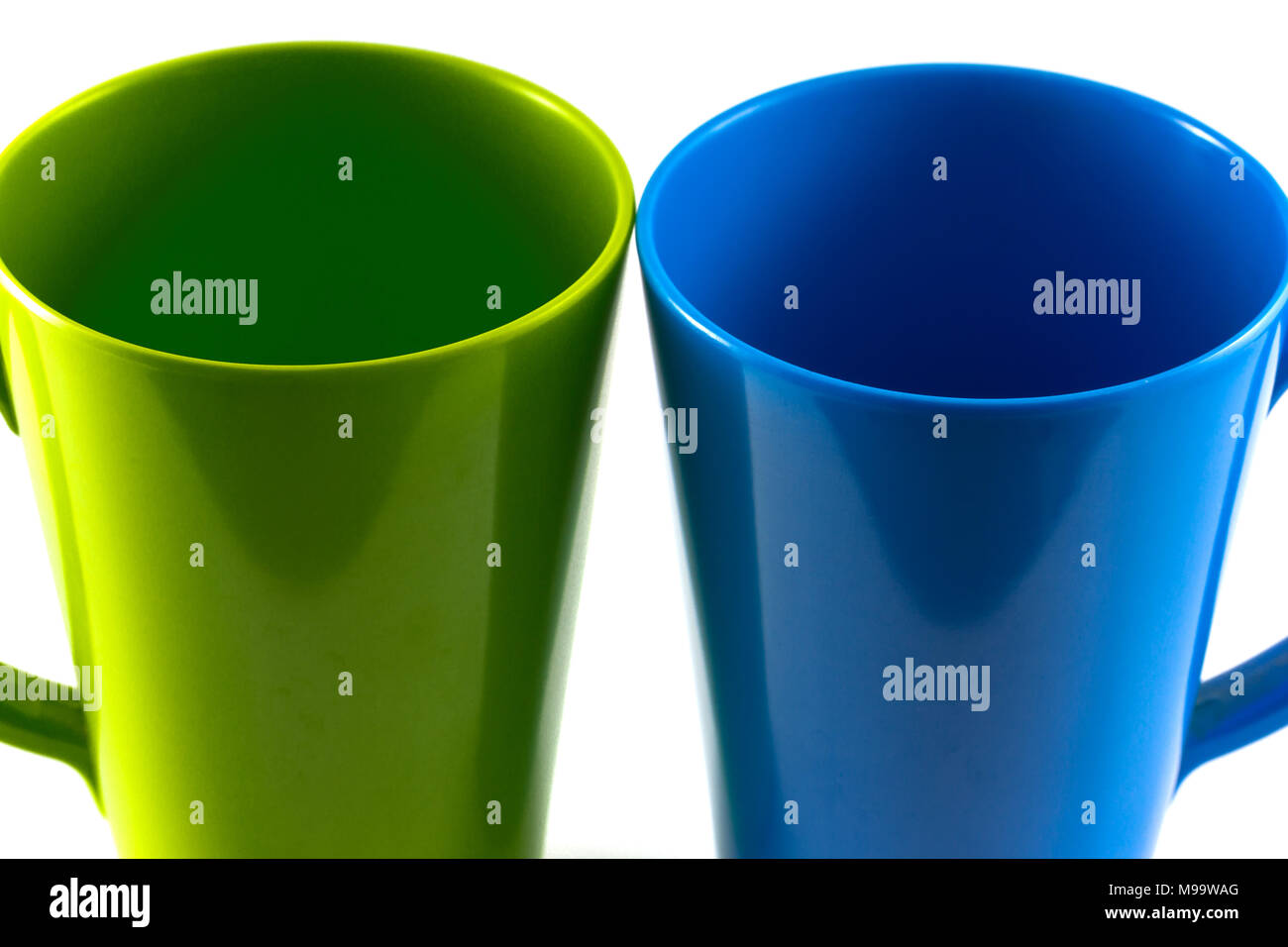 Green and blue cup isolate on white background Stock Photo - Alamy