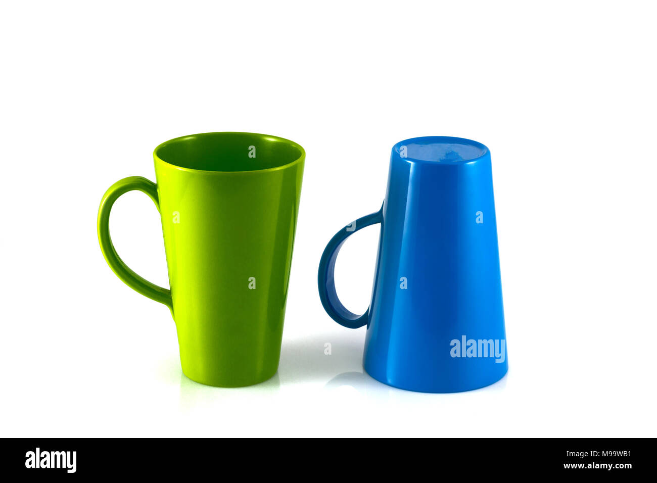Green and blue cup isolate on white background Stock Photo - Alamy