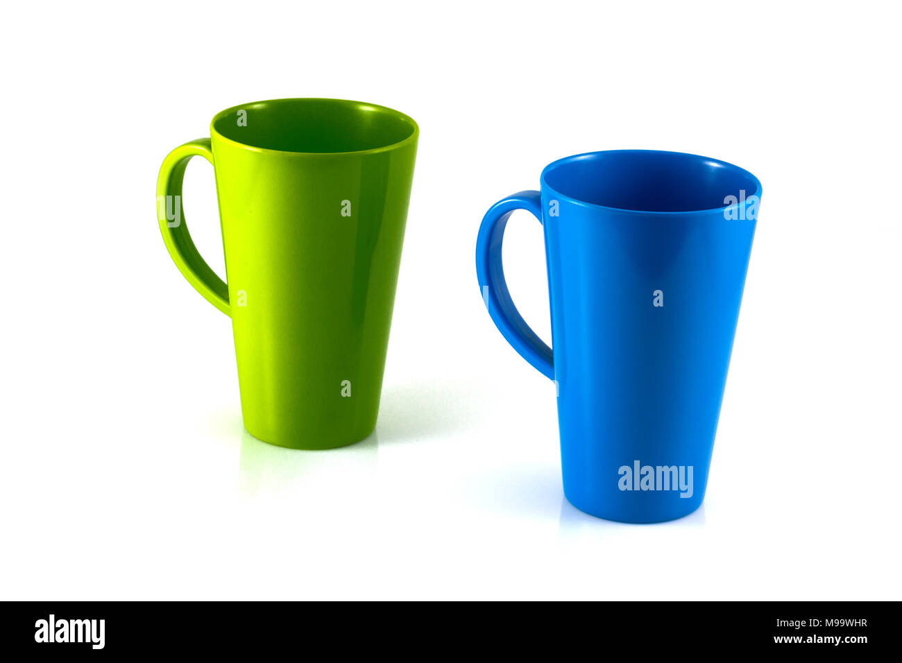 Green and blue cup isolate on white background Stock Photo - Alamy