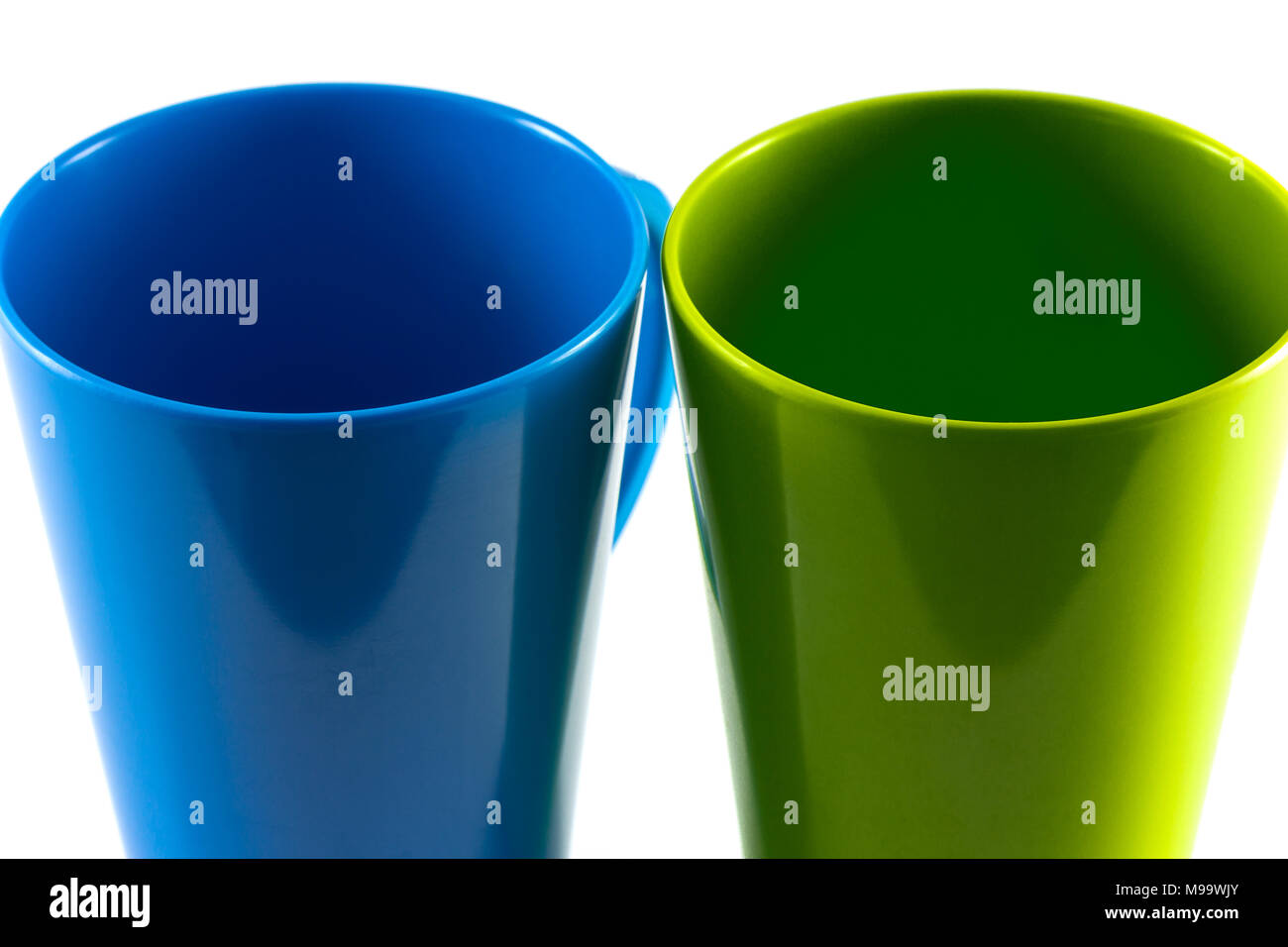 Green and blue cup isolate on white background Stock Photo - Alamy