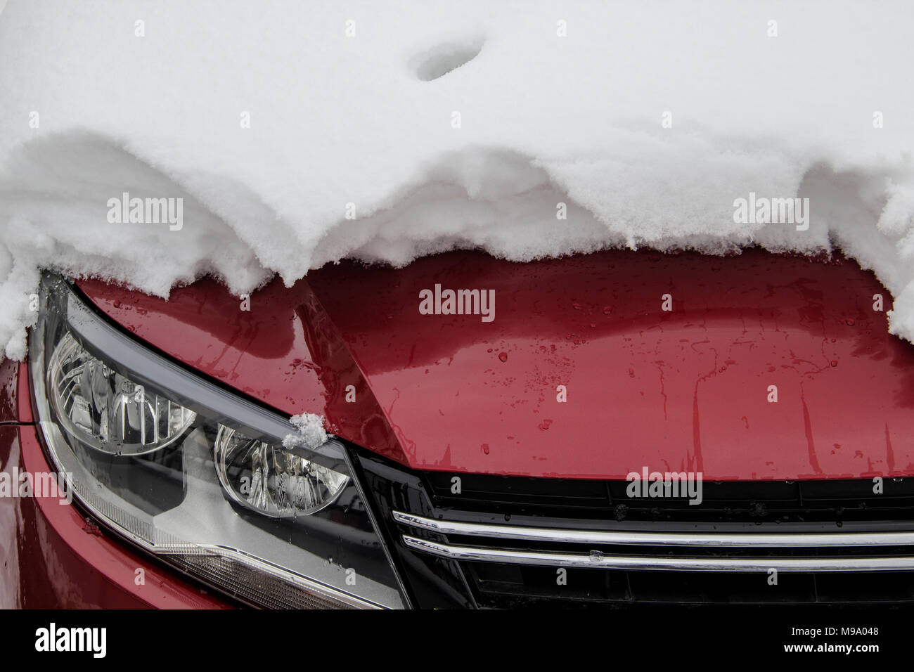 Snow On The Hood Of The Car Stock Photo - Alamy