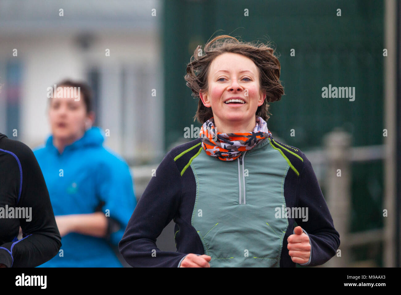 Hastings, East Sussex, UK. 24th Mar, 2018. female runner with a smile ...