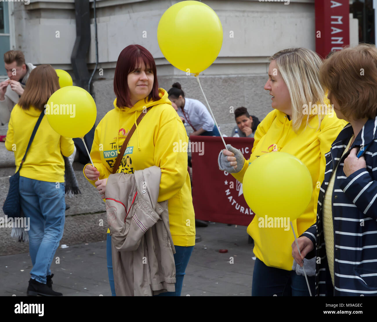London,UK,24th March 2018, Women dressed in yellow support ...