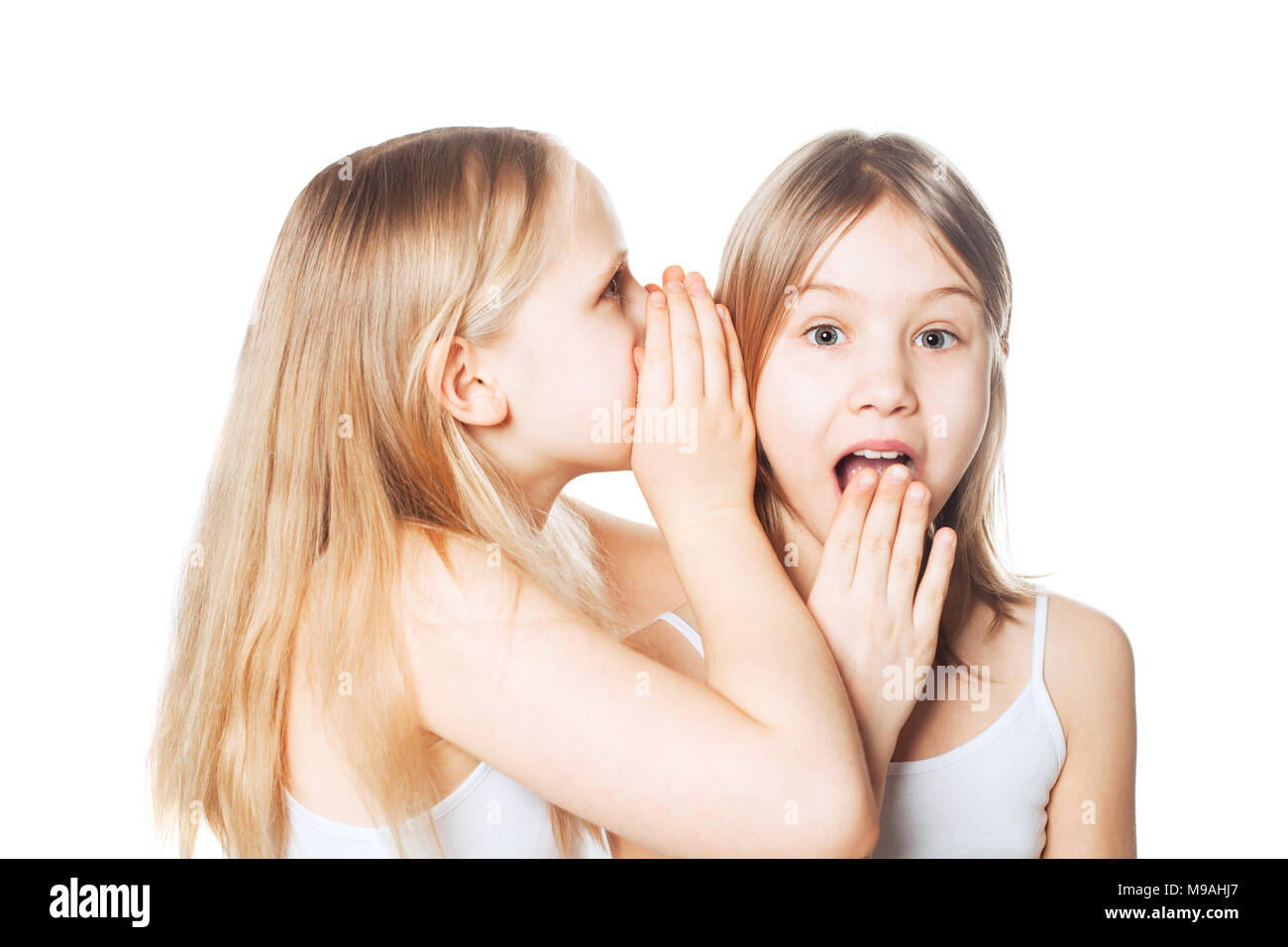 Gossip. Woman whispers to the friend secrets Stock Photo - Alamy