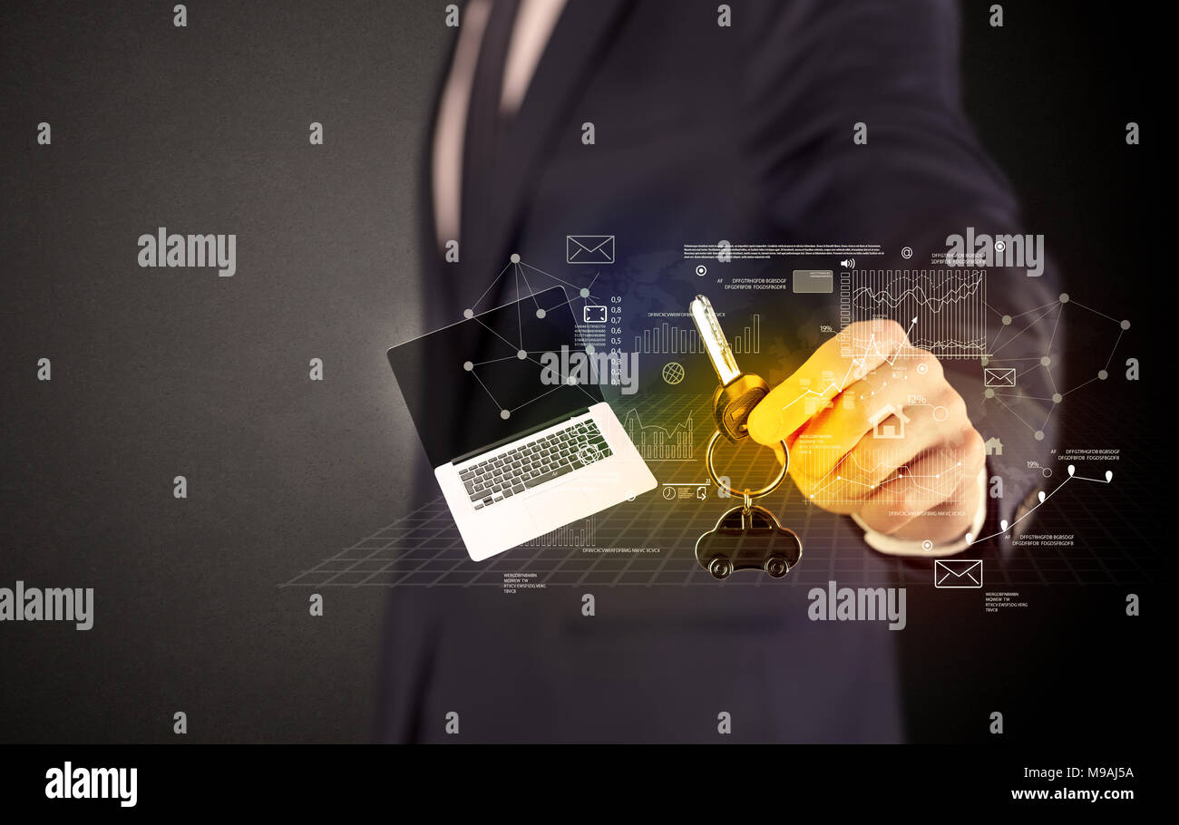 Businessman in suit holding keys with statistics, graphs and icons ...