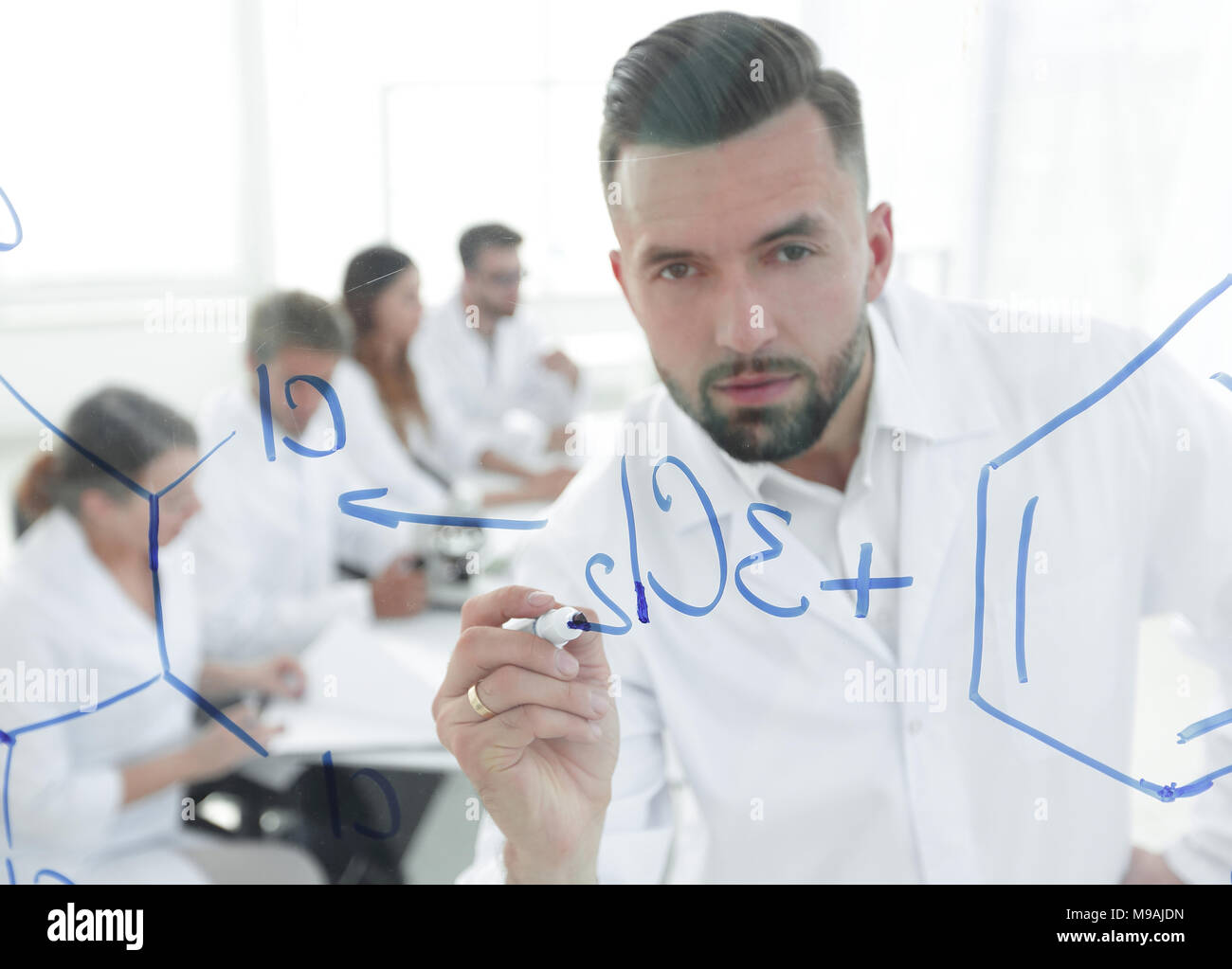 closeup of a serious scientist working with formulas Stock Photo - Alamy