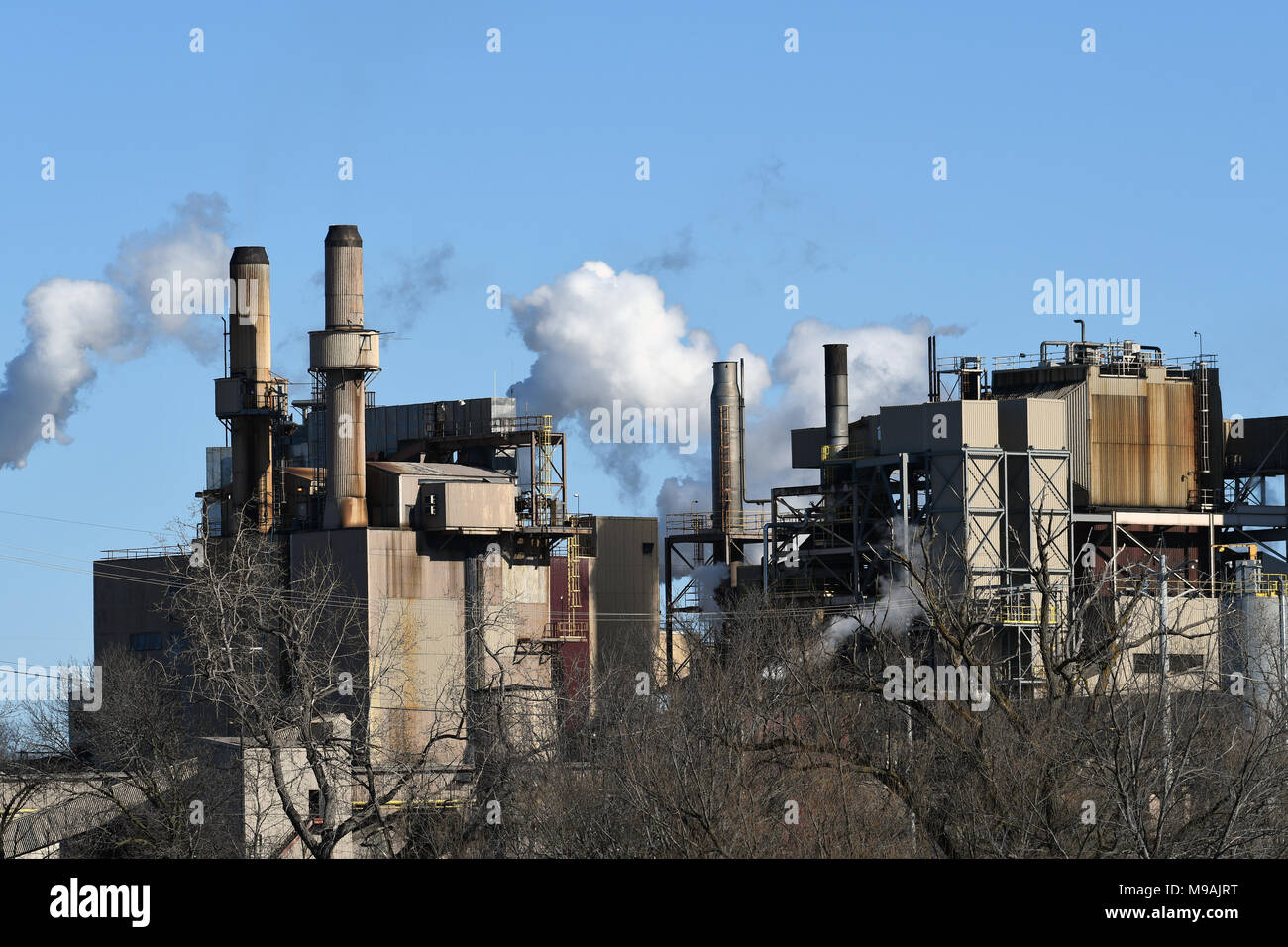 Industrial Factory with smoke stacks Stock Photo - Alamy