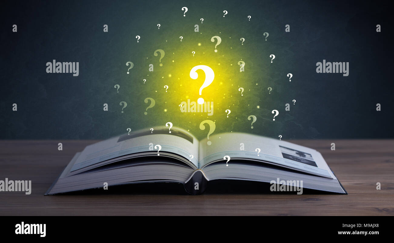 Yellow question marks hovering over open book Stock Photo - Alamy