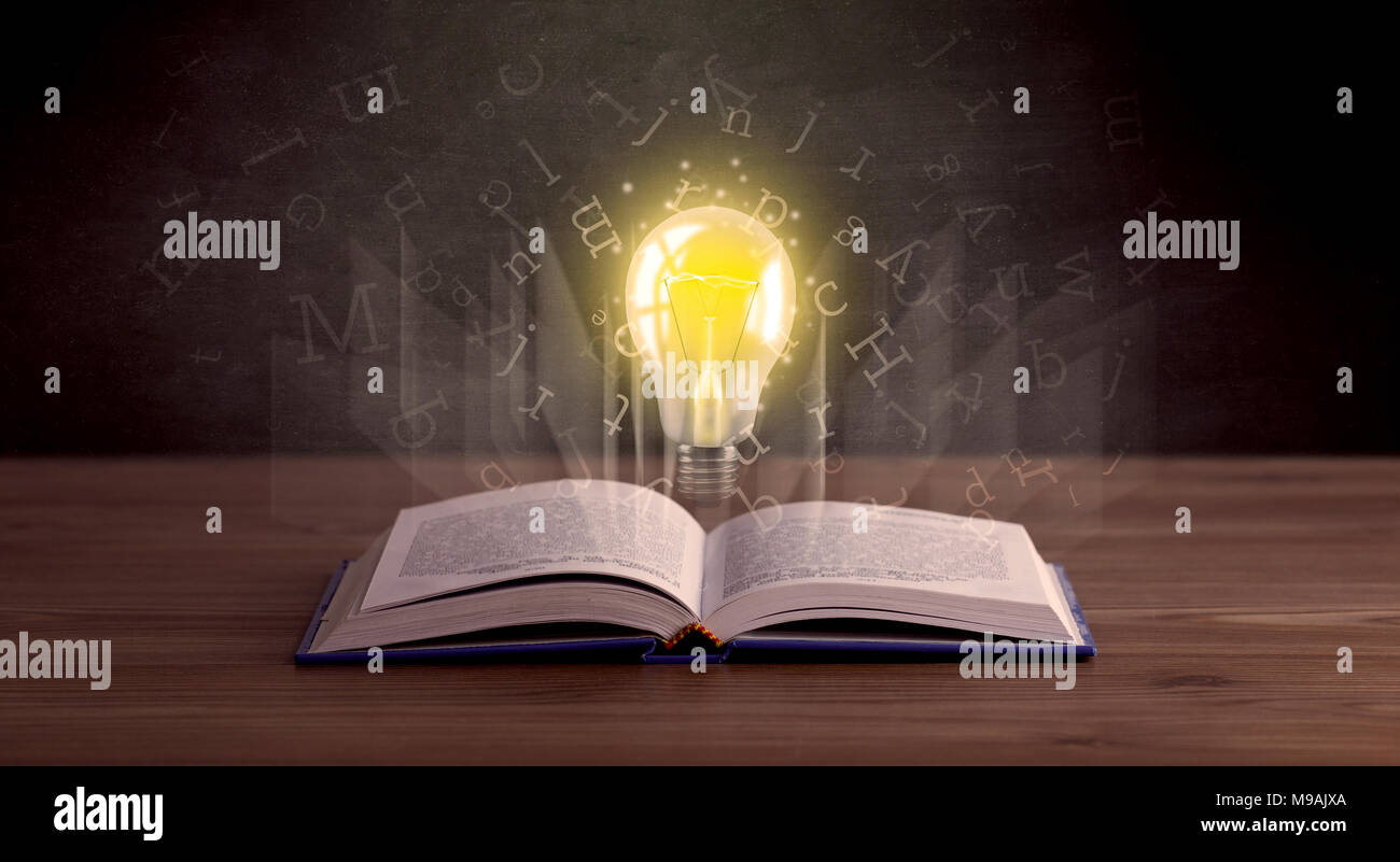 Shiny alphabet letters and yellow lightbulb hovering over open book ...