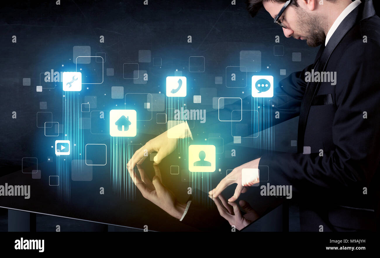 Modern smart table with high tech icons on its interface screen concept ...