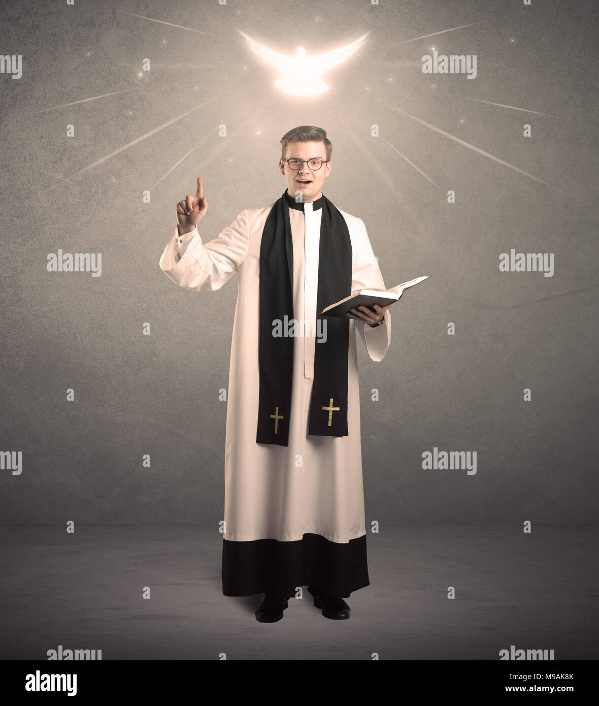 A holy priest reading a prayer from the holy bible with illustrated ...