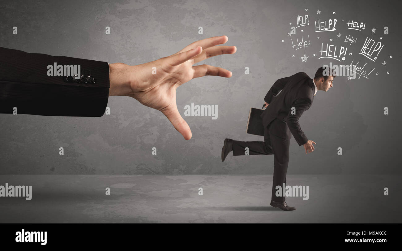 Business person running away from big hand while asking for help ...