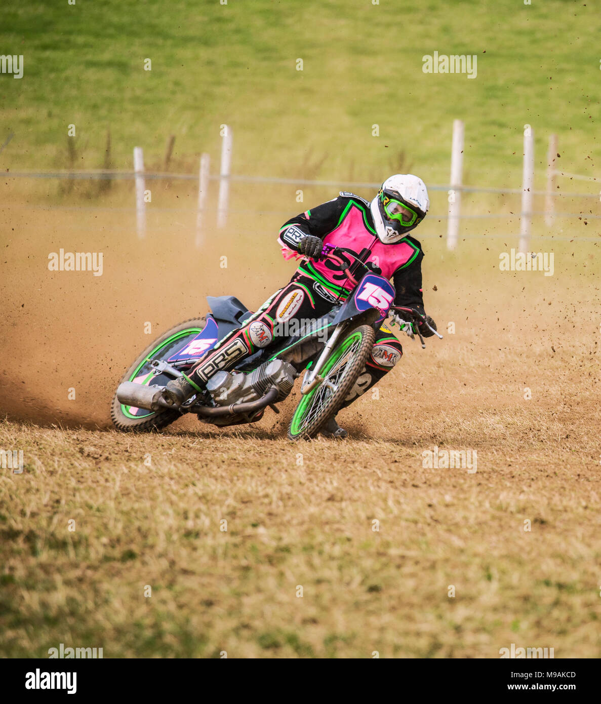 Grass track motorcycle racing action Stock Photo - Alamy