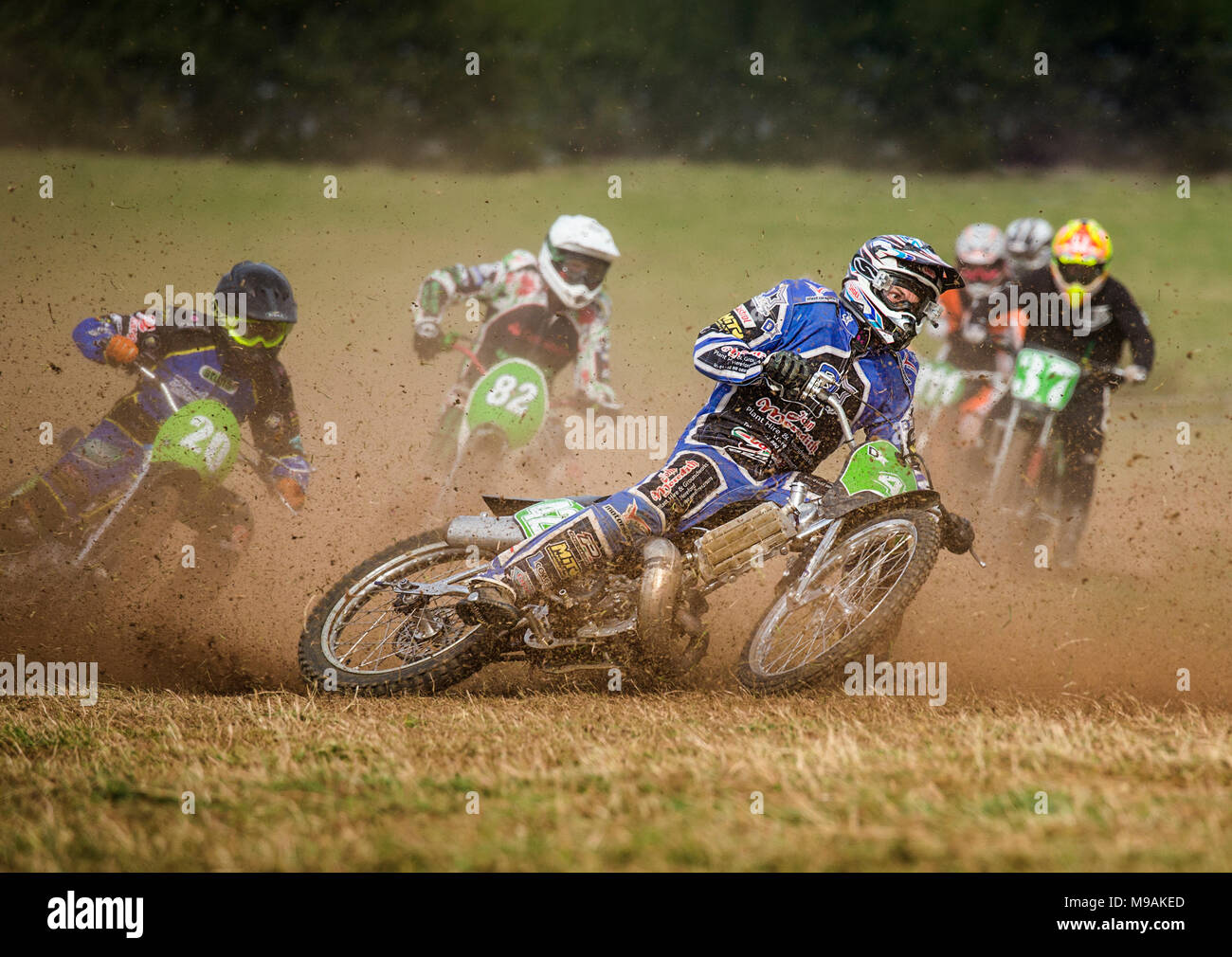 Grass track motorcycle racing action Stock Photo - Alamy