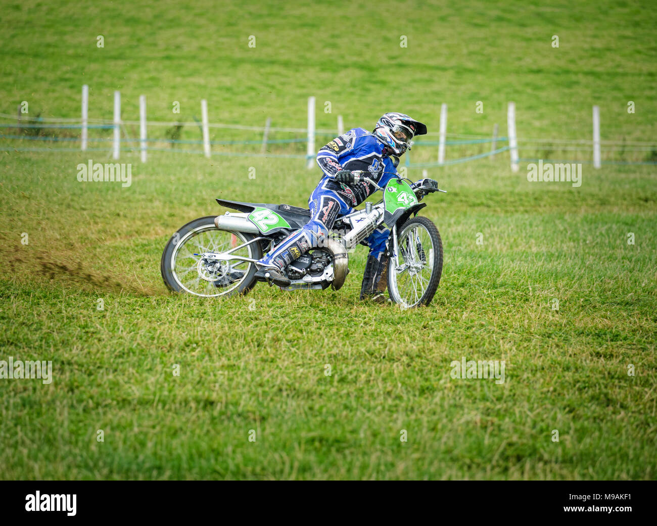 Grass track motorcycle racing action Stock Photo - Alamy