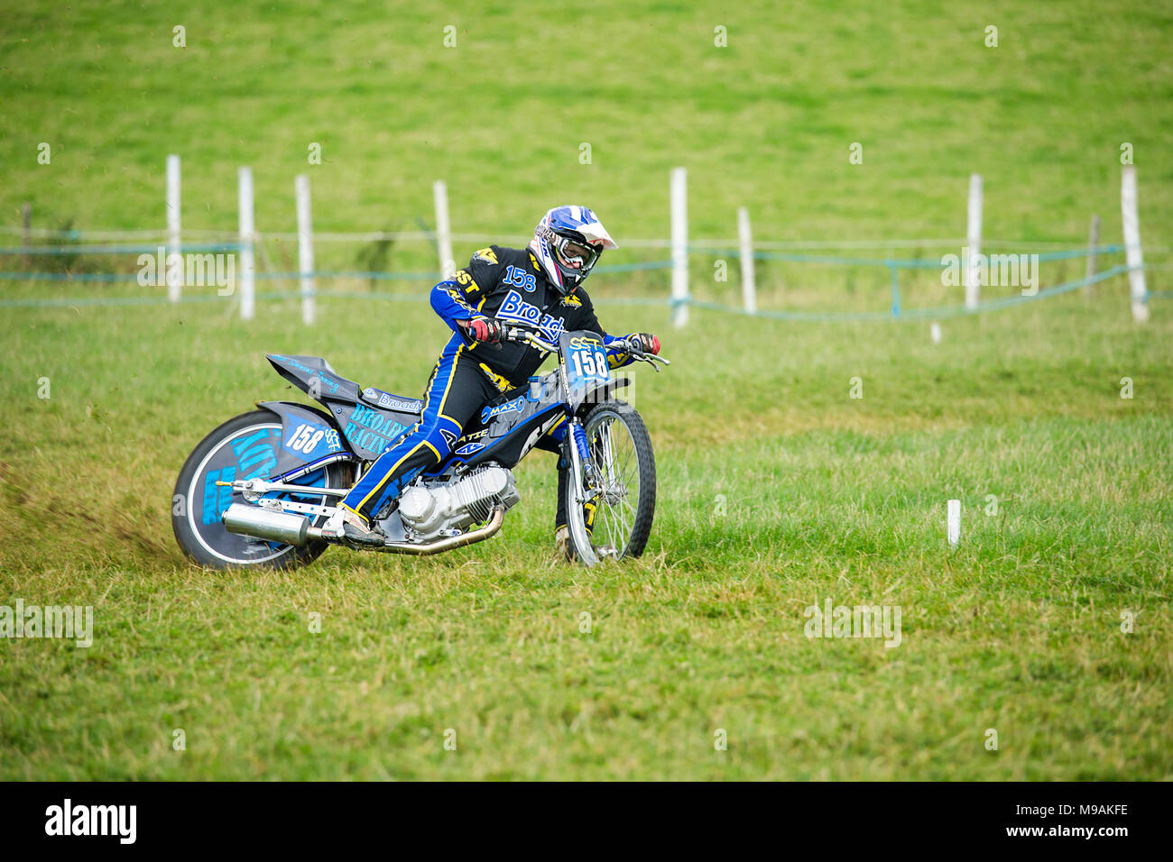 Grass track motorcycle racing action Stock Photo - Alamy