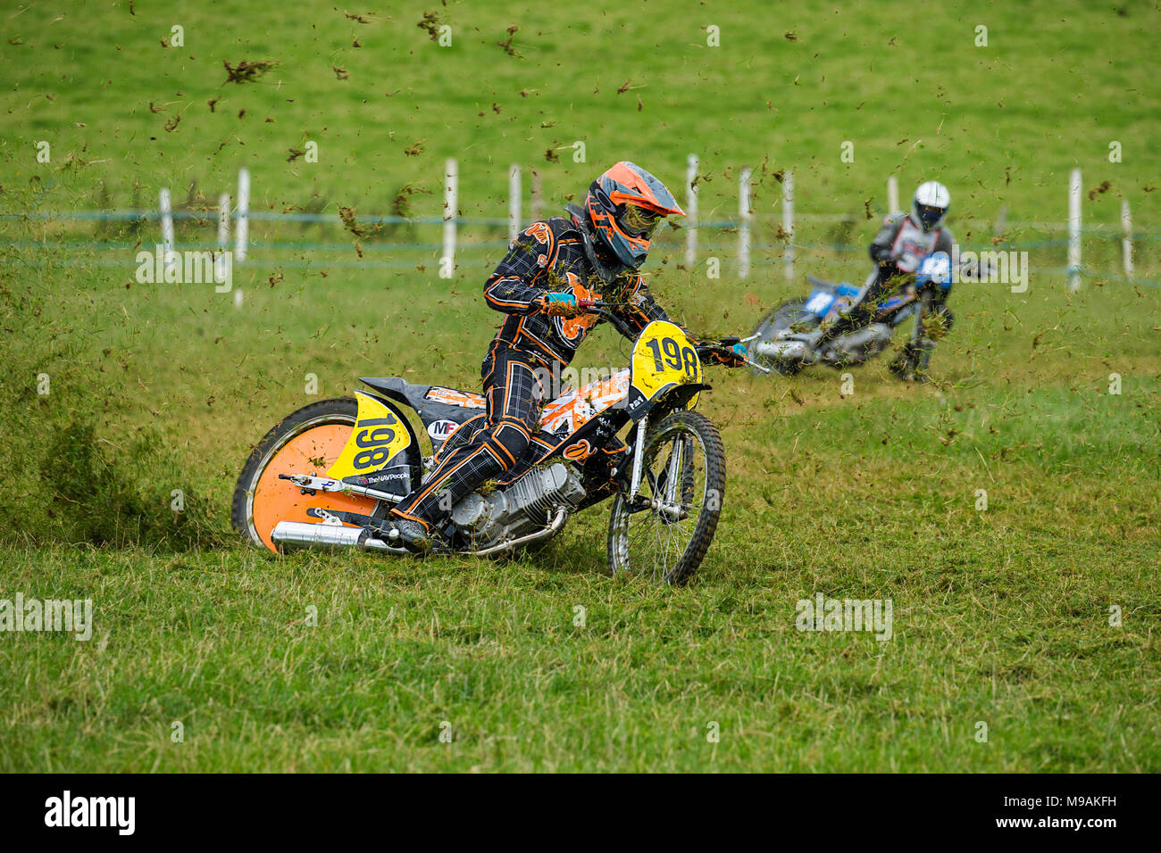 Grass track motorcycle racing action Stock Photo - Alamy