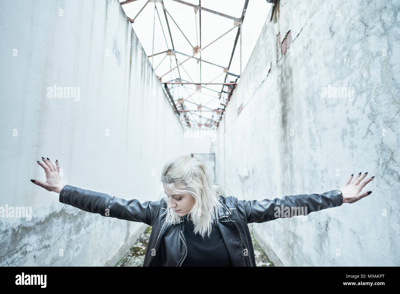 Young woman posing in strange ruins Stock Photo - Alamy