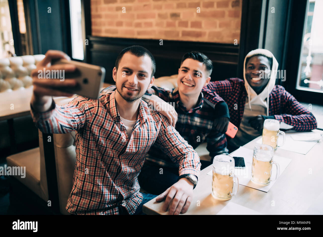 Three Guys Drinking Beer High Resolution Stock Photography and Images ...