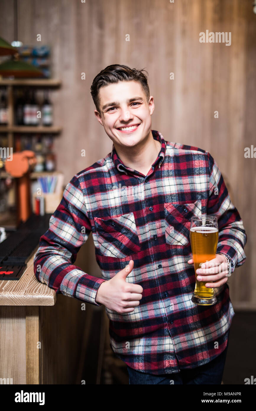 Handsome smiling male waiter giving hi-res stock photography and images ...