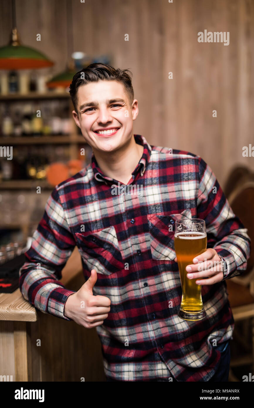 Young working class man in bar hi-res stock photography and images - Alamy