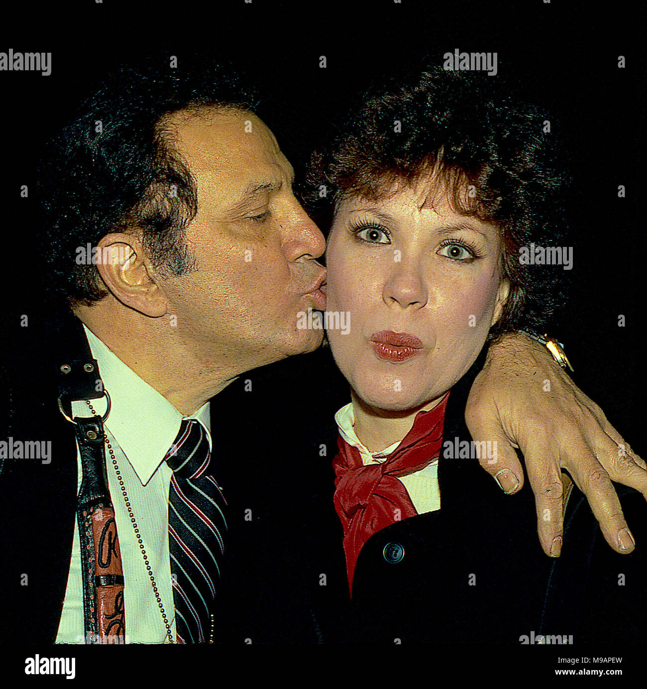 Washington, DC., USA, December 3, 1983 Ron Galella kisses his wife ...