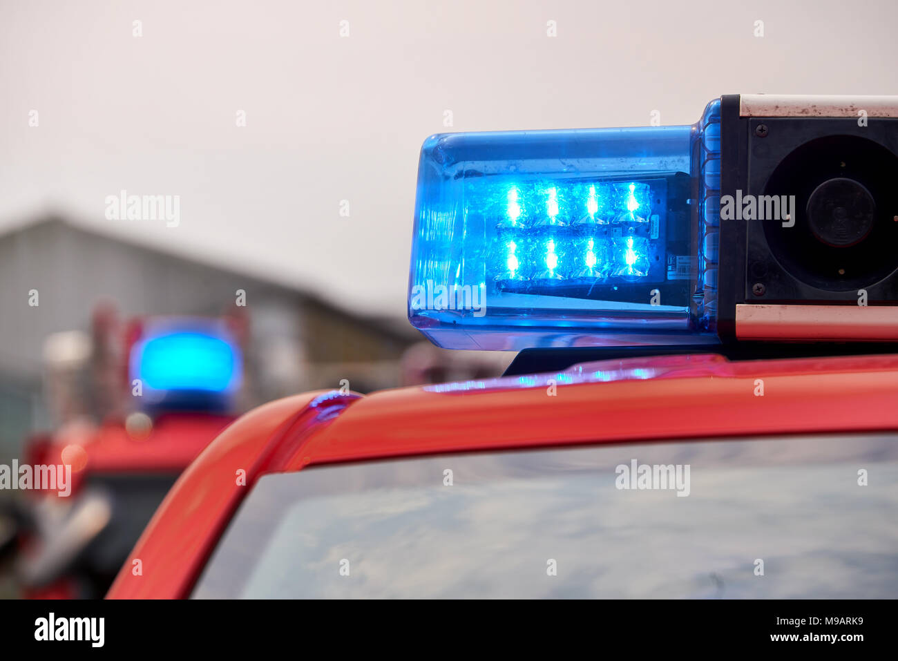 fire fighter trucks with blue flashing lights Stock Photo - Alamy