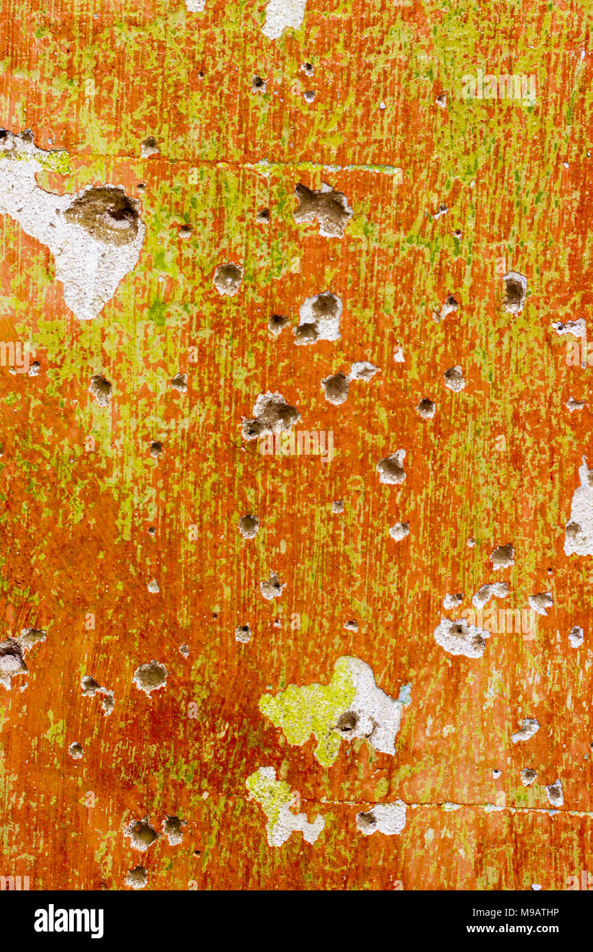 Red wall with bullets shoot holes background. Rough housework wallpaper ...