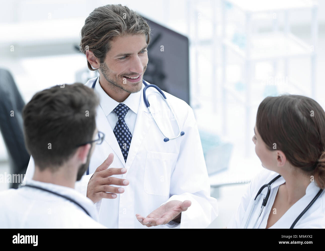 Group of doctors talking Stock Photo - Alamy