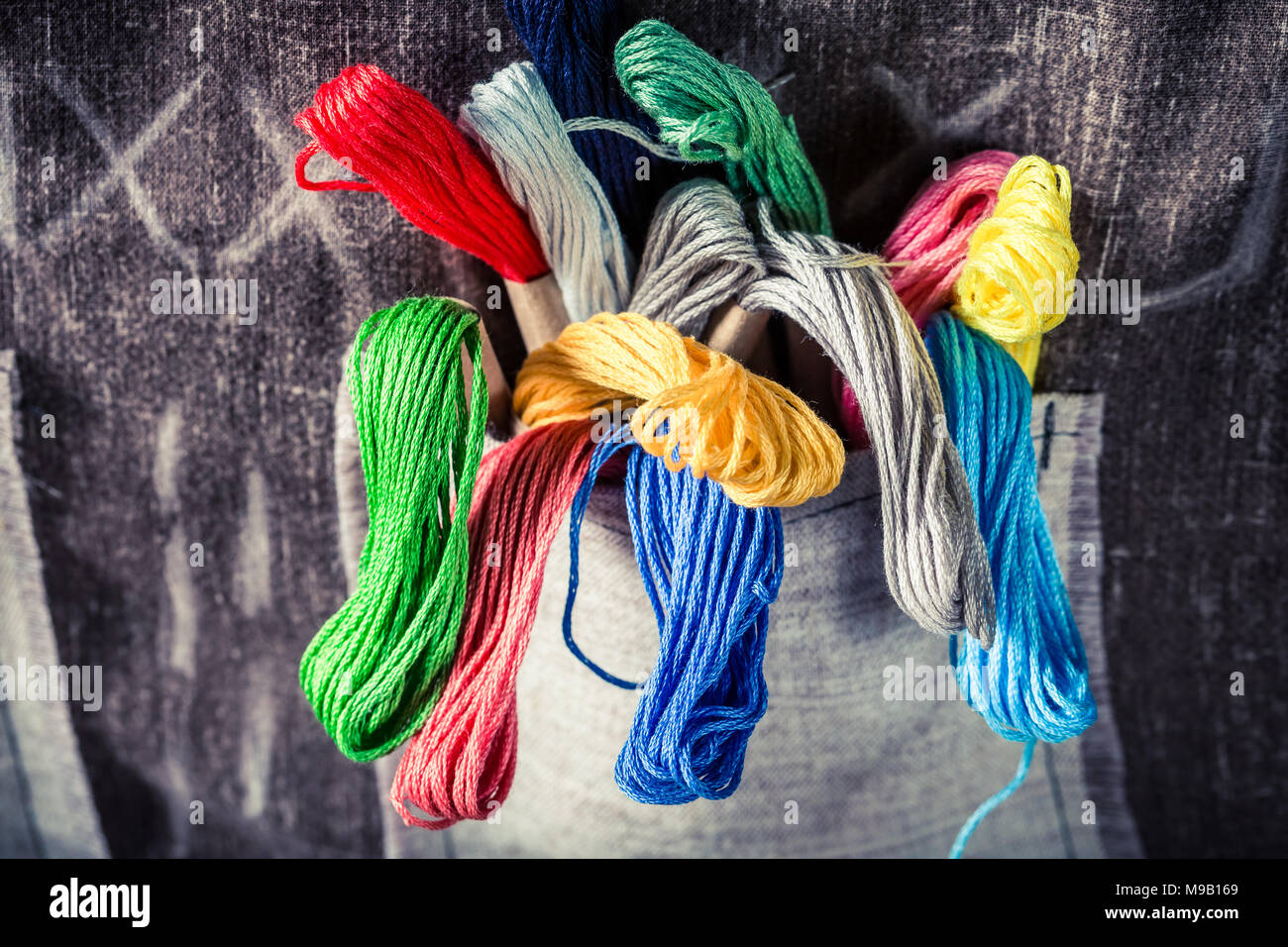Colored threads in sewing workshop hi-res stock photography and images ...