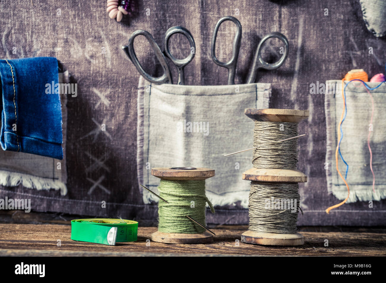 Handmade tailor background with scissors, threads and needles Stock ...