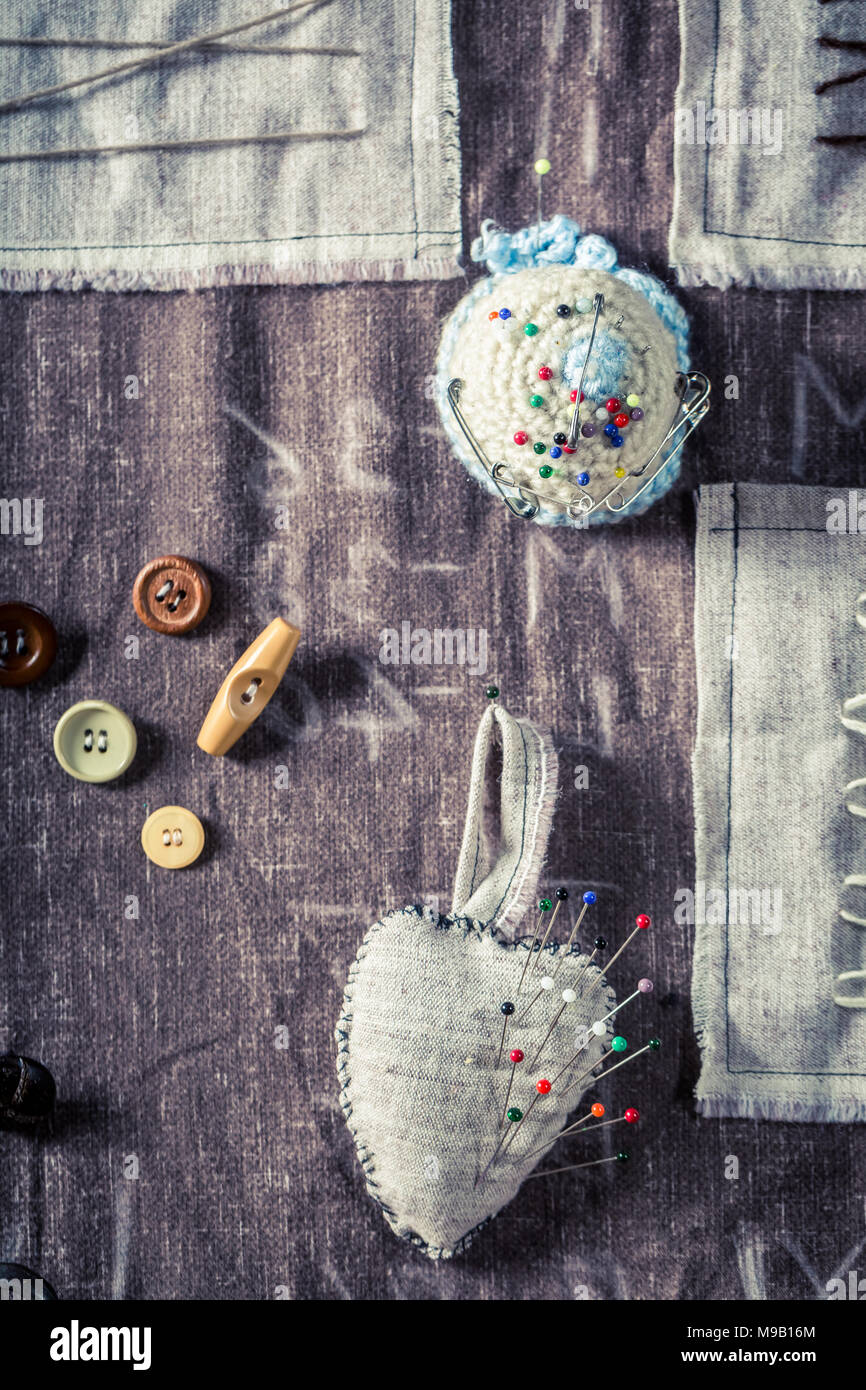 Closeup of background with threads and needles in tailor workshop Stock ...