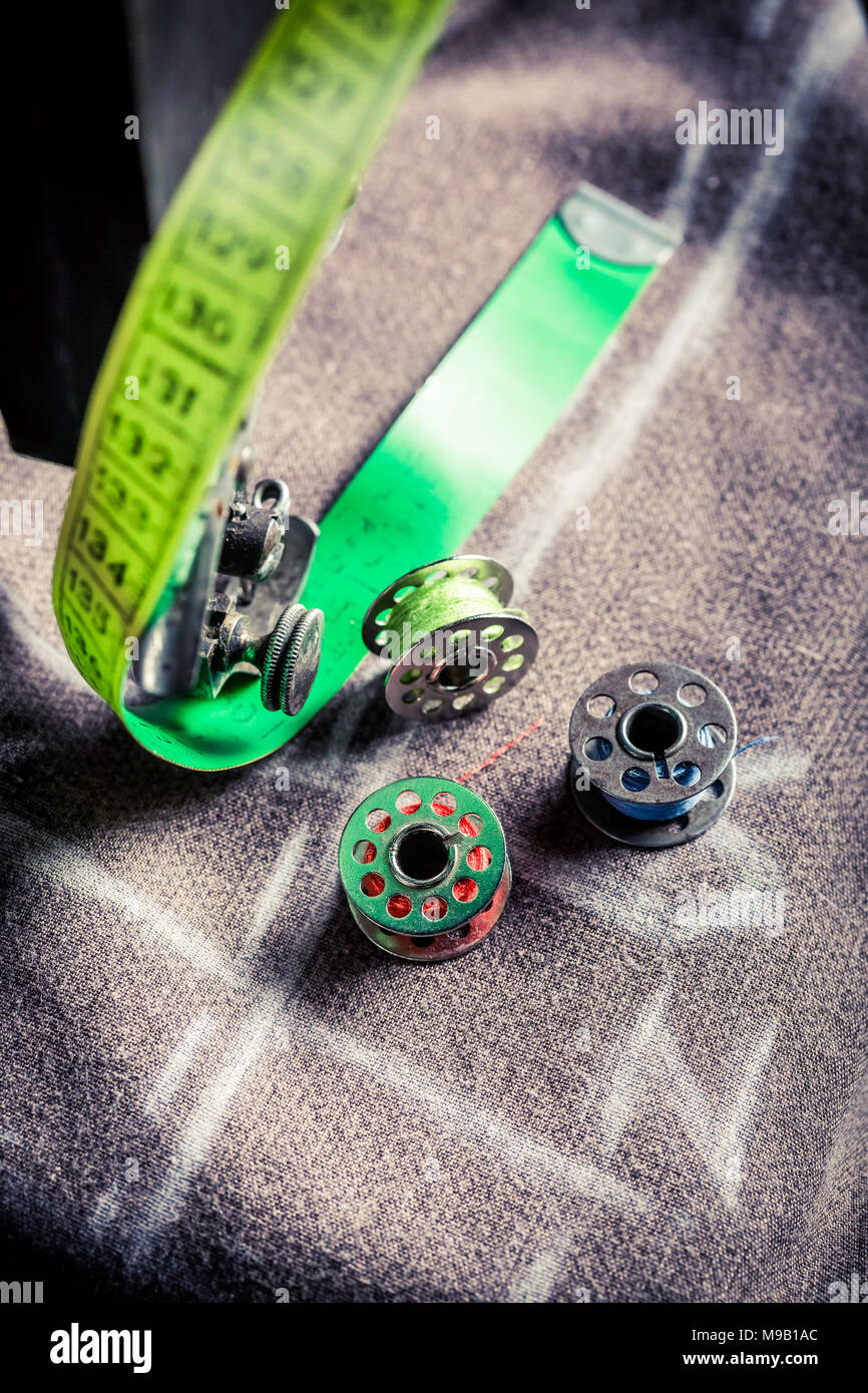 Closeup of tailor tape, threads and material Stock Photo - Alamy