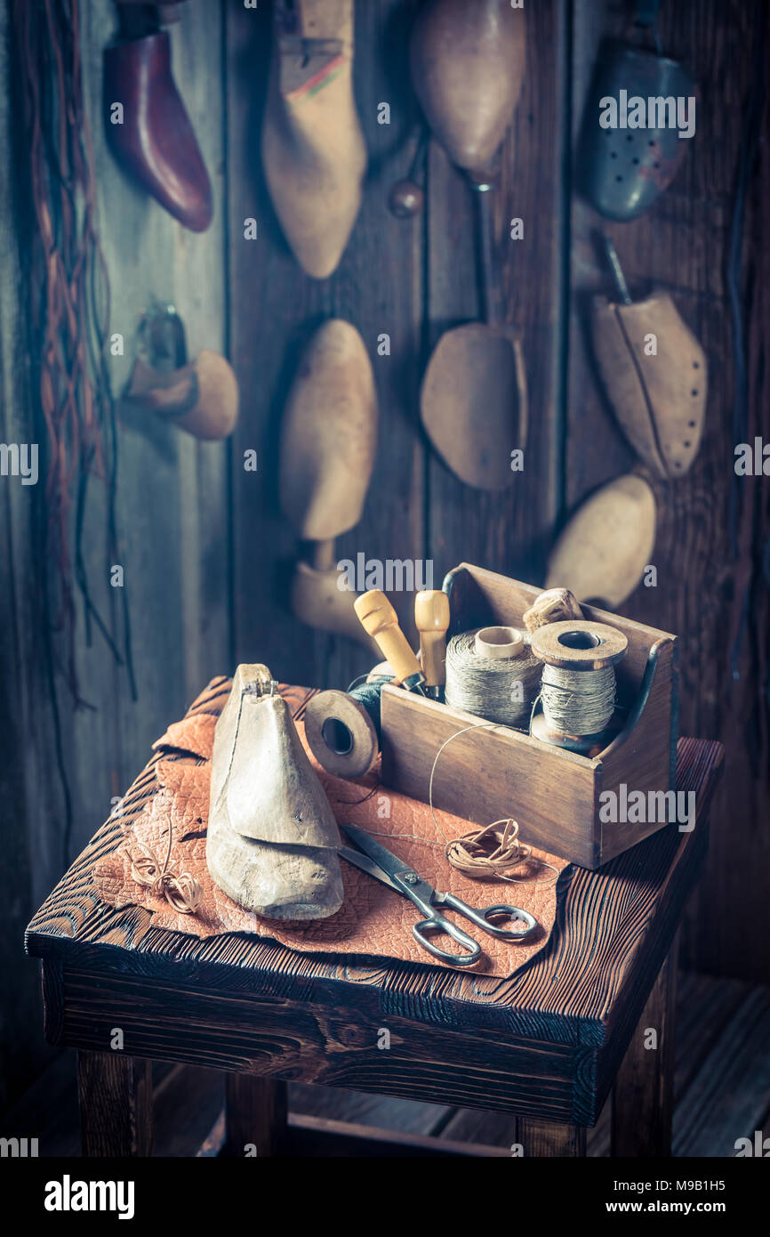 Cobbler workshop with tools and leather to making shoes Stock Photo - Alamy