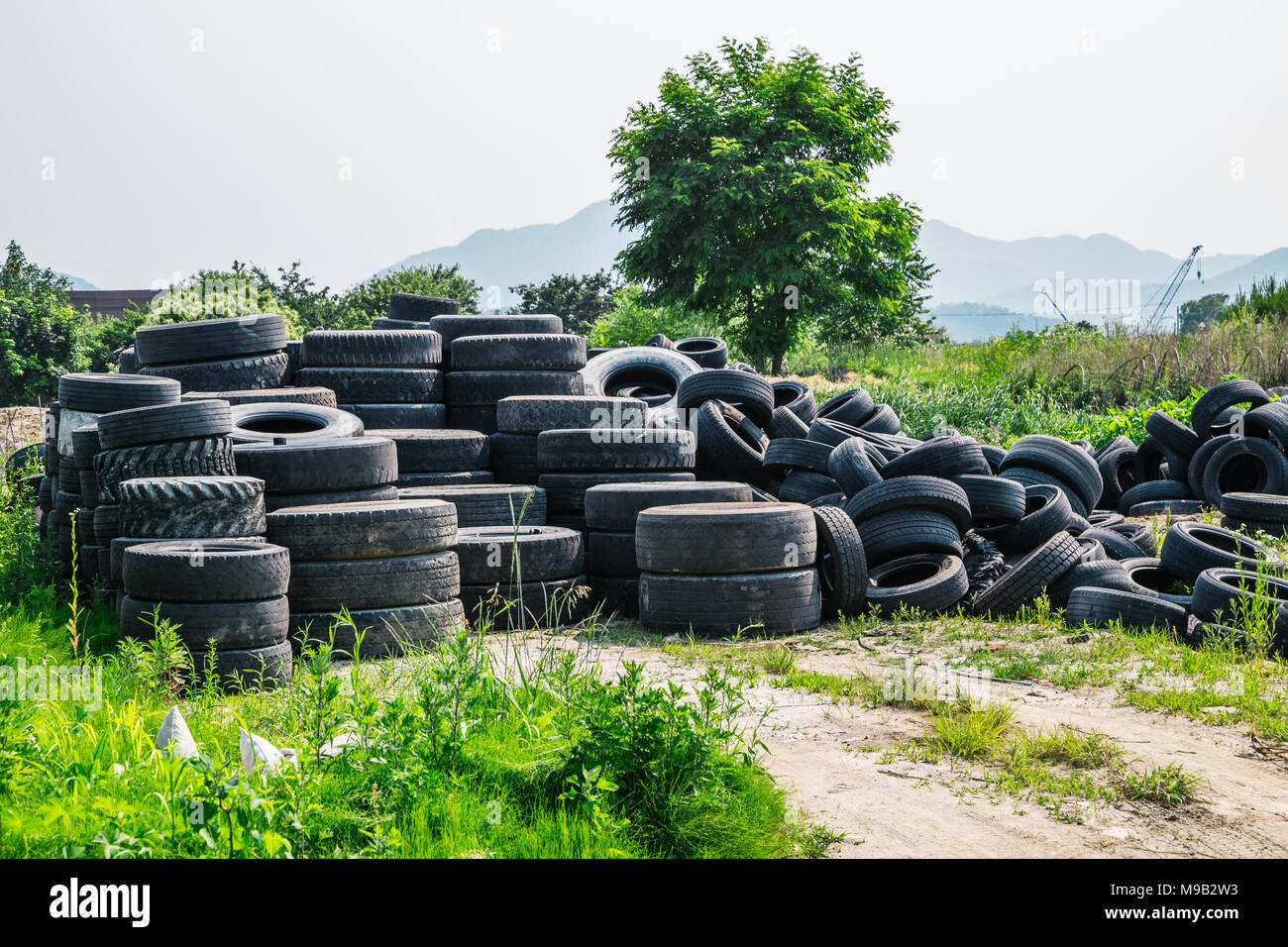 Piles of waste rubber tire Stock Photo - Alamy