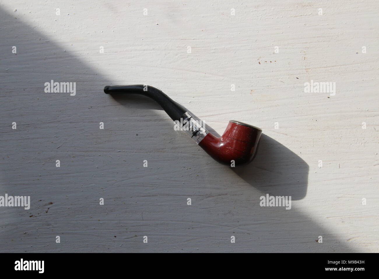 brown tobacco pipe color image on a white background Stock Photo - Alamy