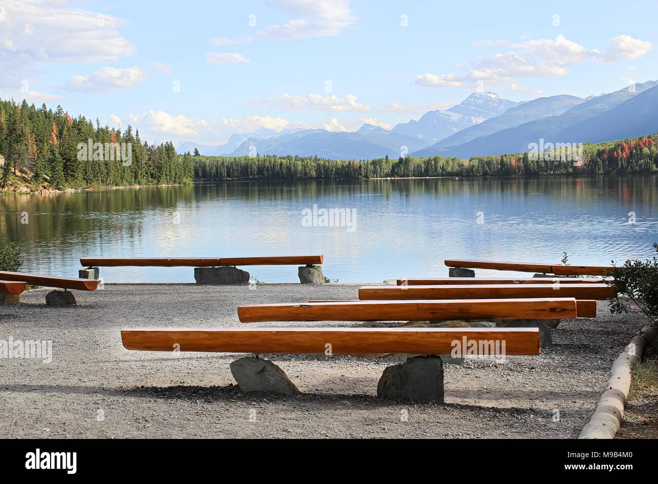 Rows of benches look over a magestic mountain view Stock Photo - Alamy
