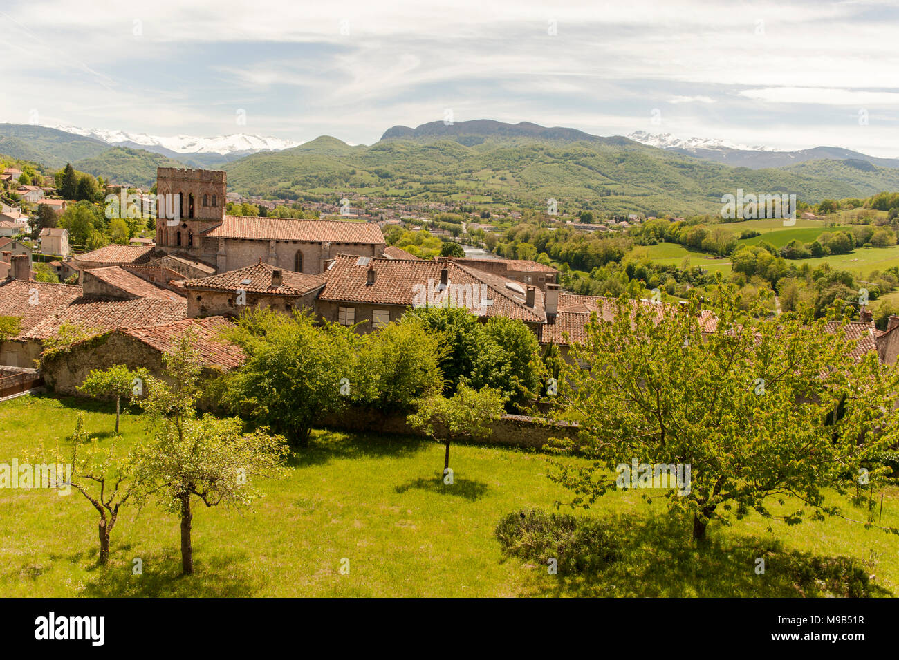 View of Saint-Lizier with its cathedral and the Pyrenees peaks taken ...