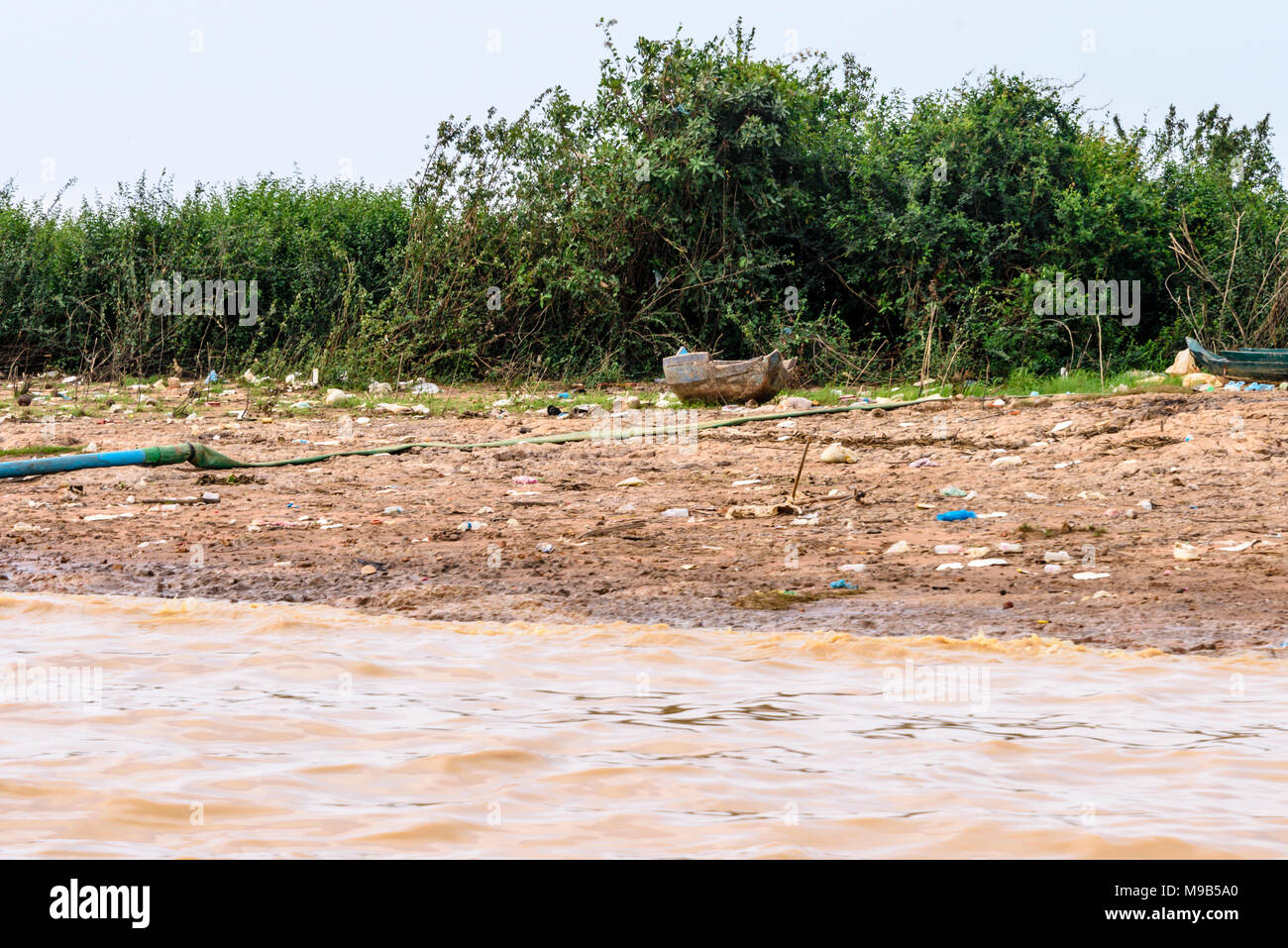 Huge amounts of plastic bottles, bags and boxes line the Siem Reap ...
