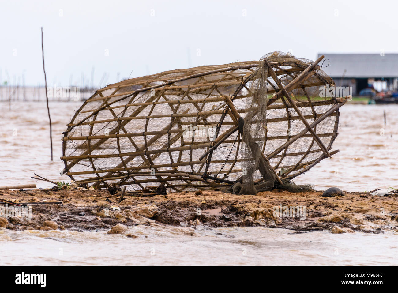 Fishing nets made from bamboo on the bank of the Siem Reap river ...